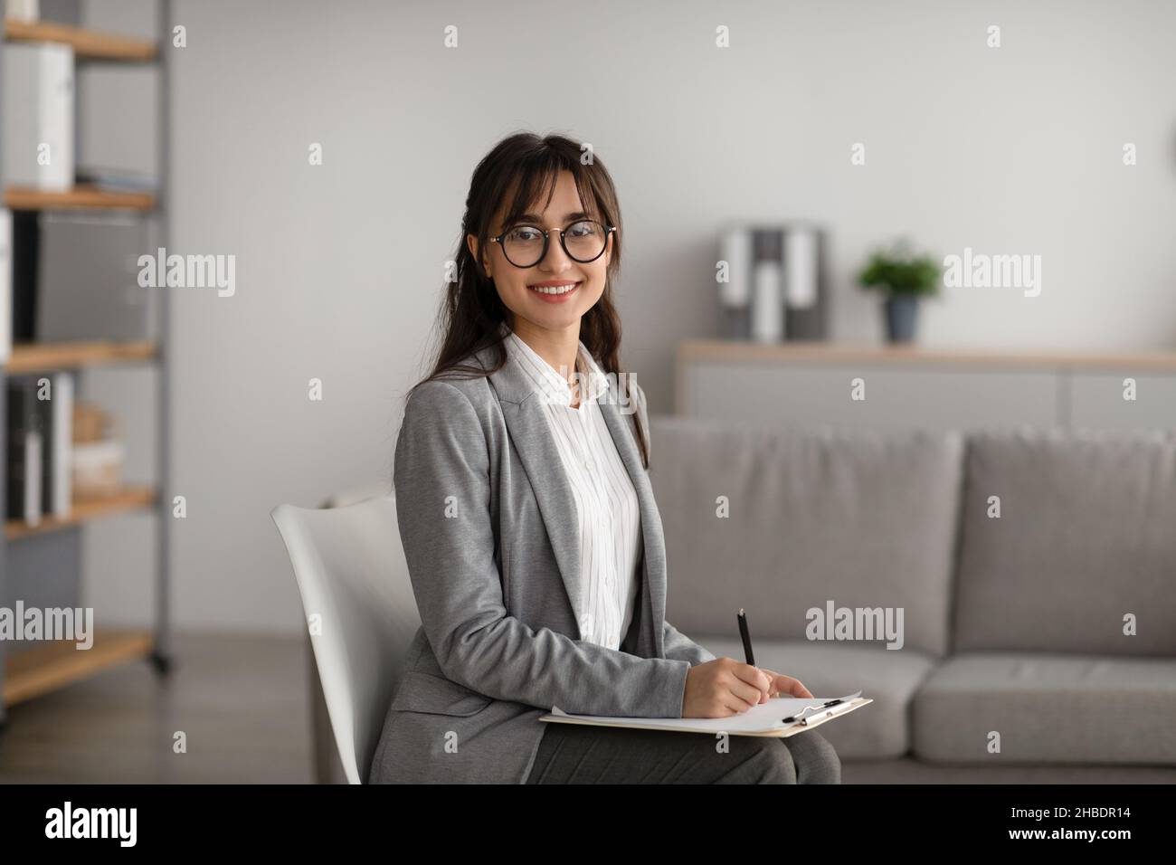 Successful psychologist. Portrait of cheerful young psychologist ...