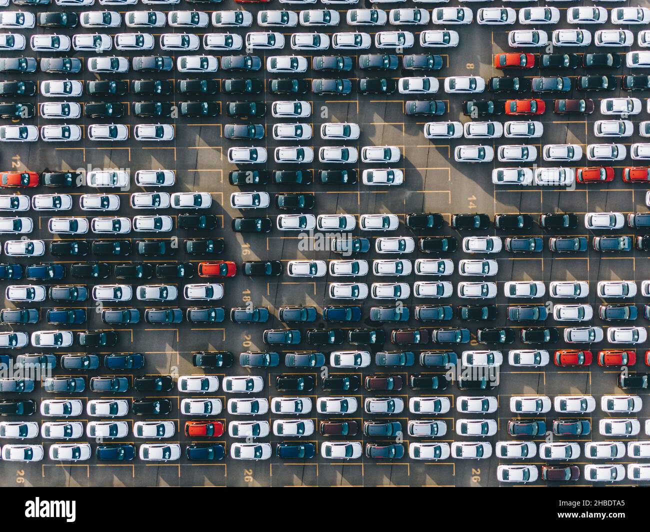 Open finished automobile warehouse of giant plant with rows of cars of ...