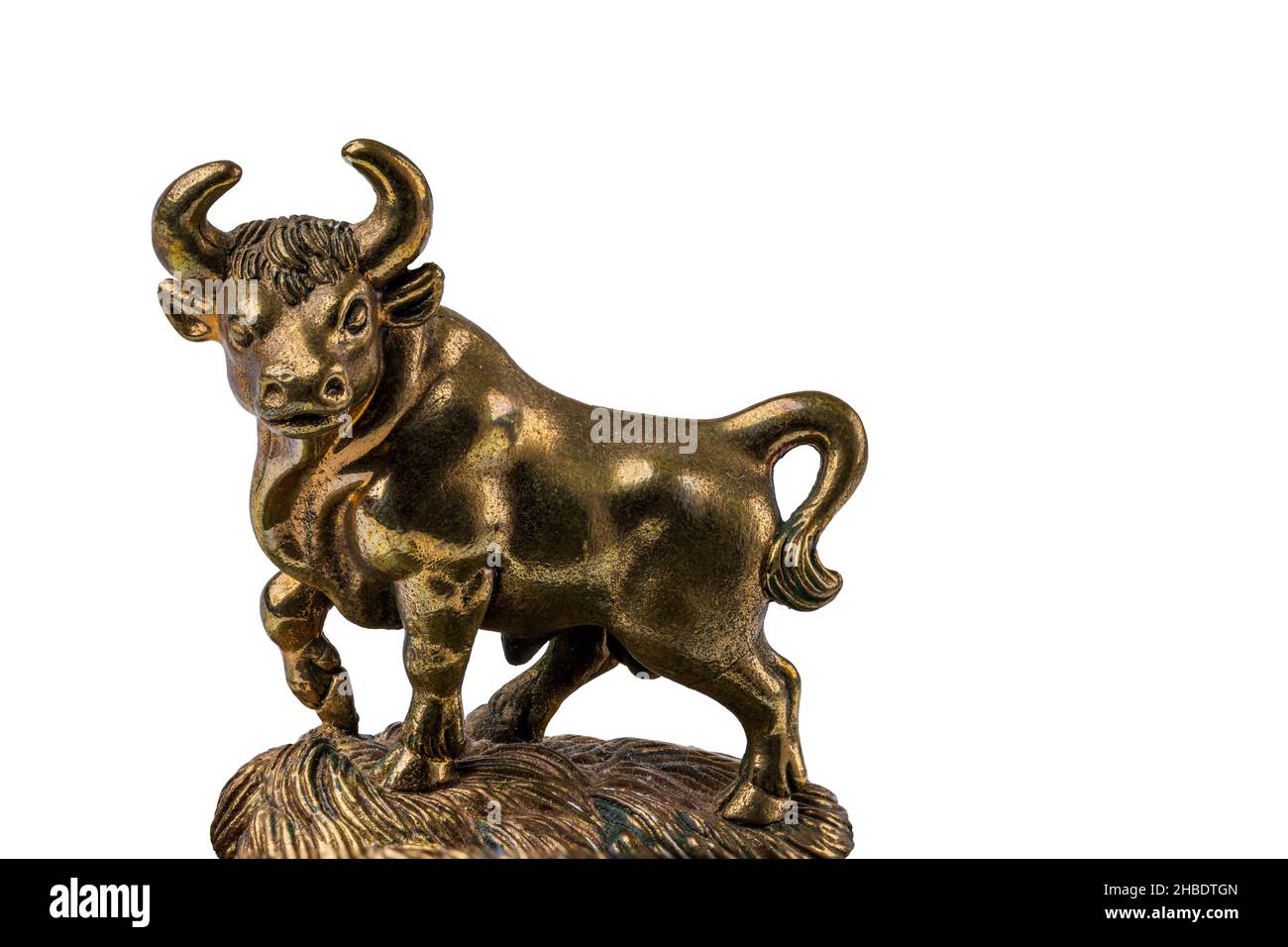 Close up view of bronze figure of Taurus cattle sign isolated on white ...