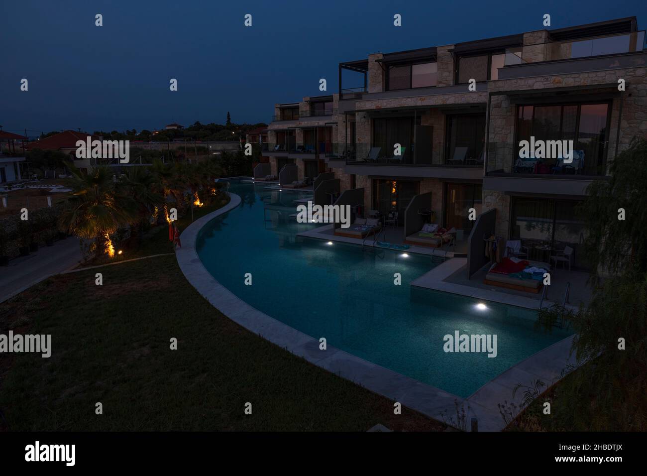 Beautiful night view of exterior of Portes Lithos Luxury Resort hotel ...