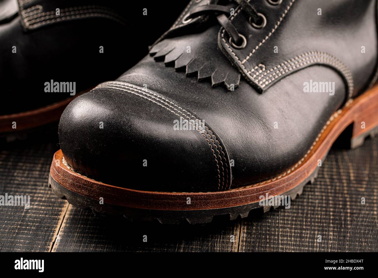 Hand crafted black leather high boots Stock Photo - Alamy