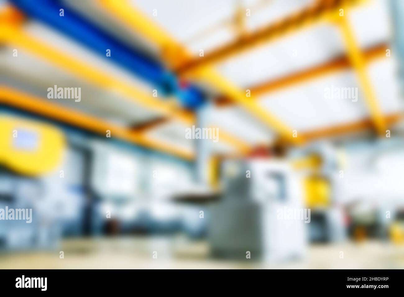 Empty production room in factory. Unfocused backdrop is industrial ...