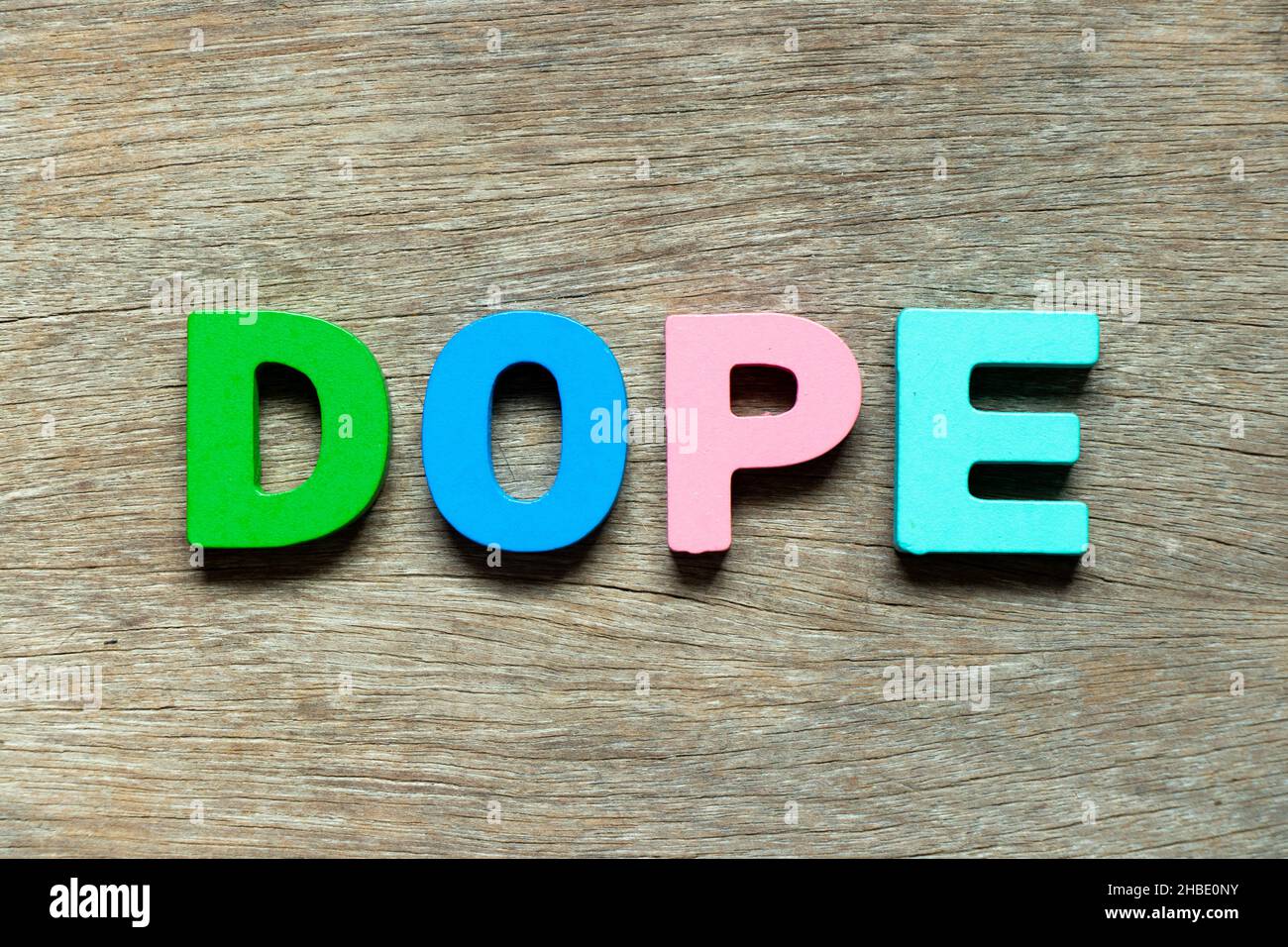 Color alphabet letter in word dope on wood background Stock Photo - Alamy