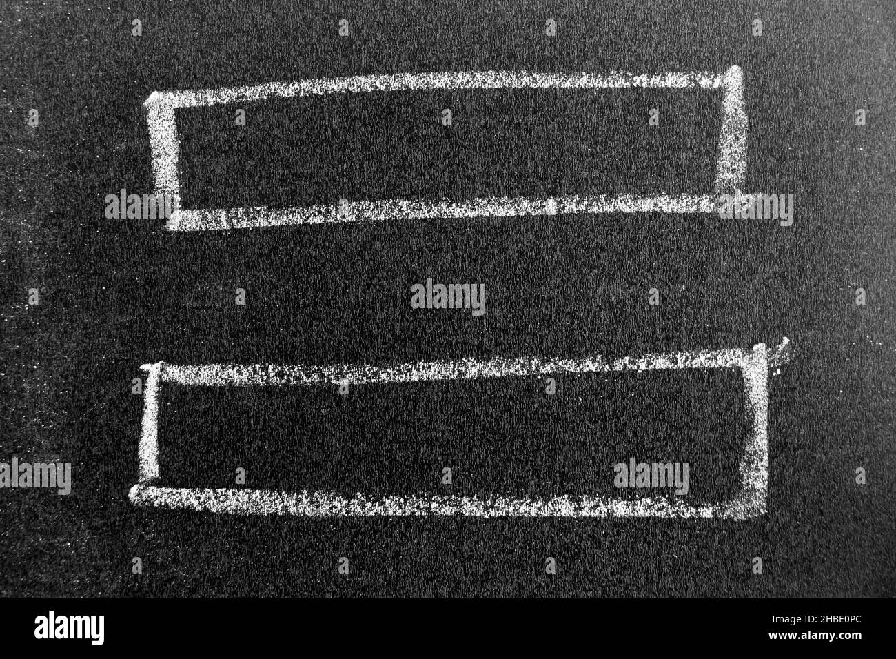 White color chalk hand drawing in square or rectangle shape on black ...