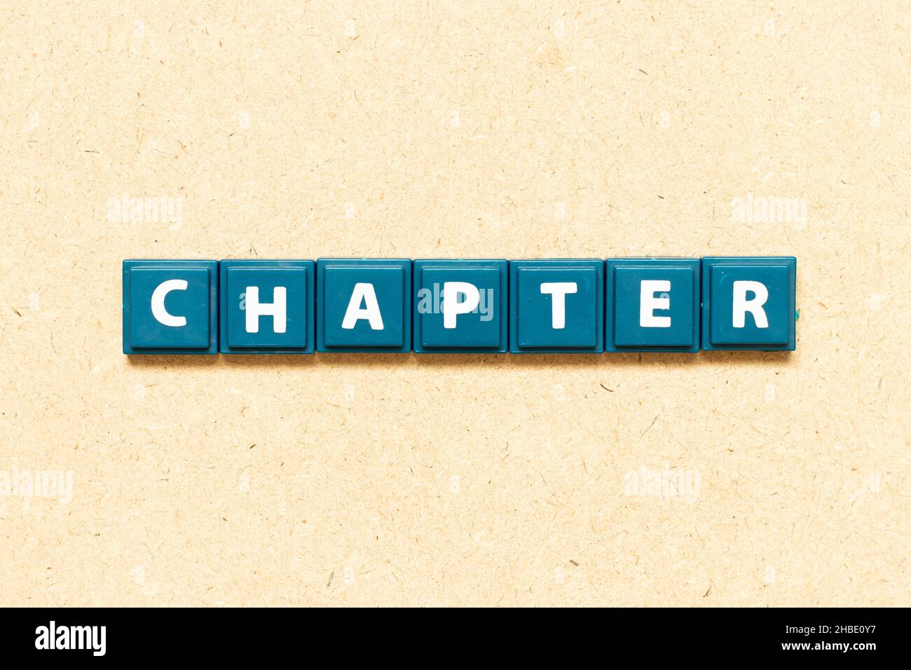 Tile alphabet letter in word chapter on wood background Stock Photo - Alamy