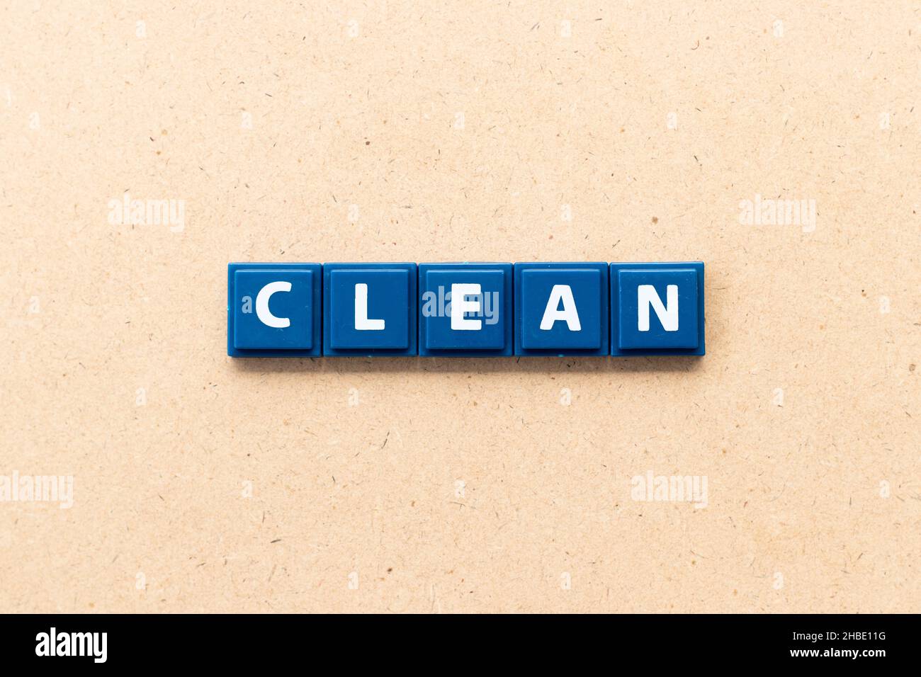 Tile letter in word clean on wood background Stock Photo - Alamy
