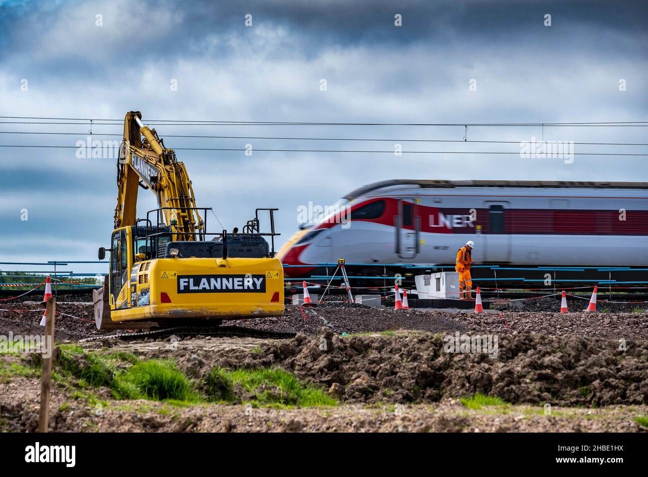 Railway workers building new railway and knocking down bridges Stock ...