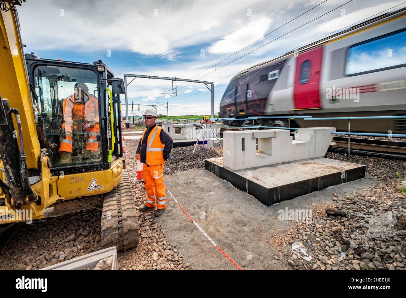 Railway workers building new railway and knocking down bridges Stock ...