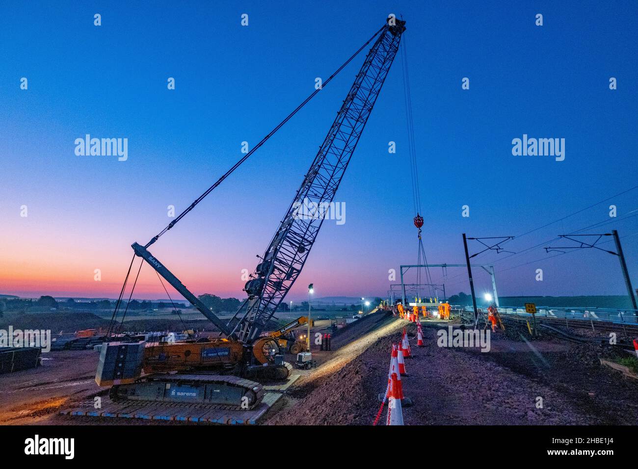 Railway workers building new railway and knocking down bridges Stock ...