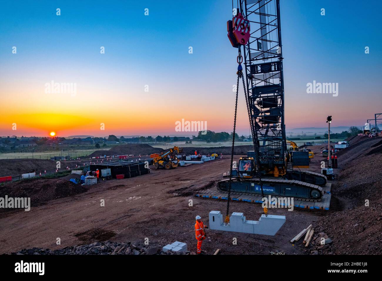 Railway workers building new railway and knocking down bridges Stock ...