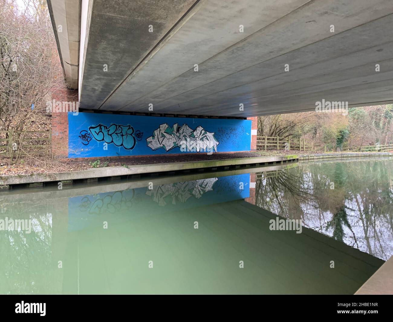 Graffiti artwork painting under M1 Bridge Grand Union Canal Northampton ...