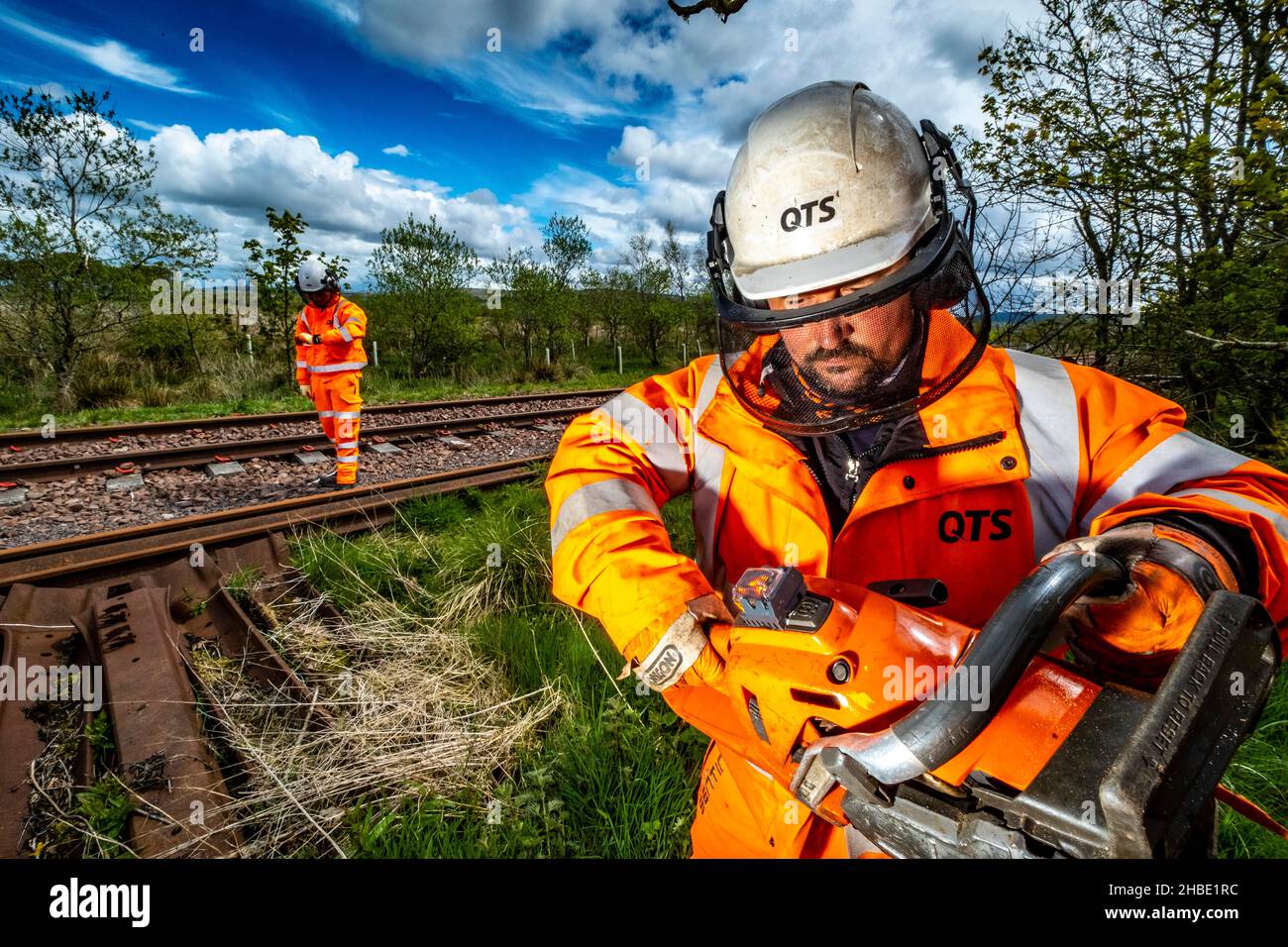 Railway workers building new railway and knocking down bridges Stock ...