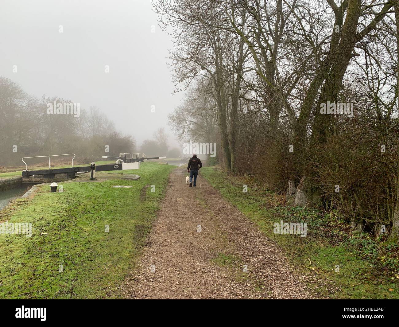 Grand Union Canal Northampton Northamptonshire Walker dog path mist ...