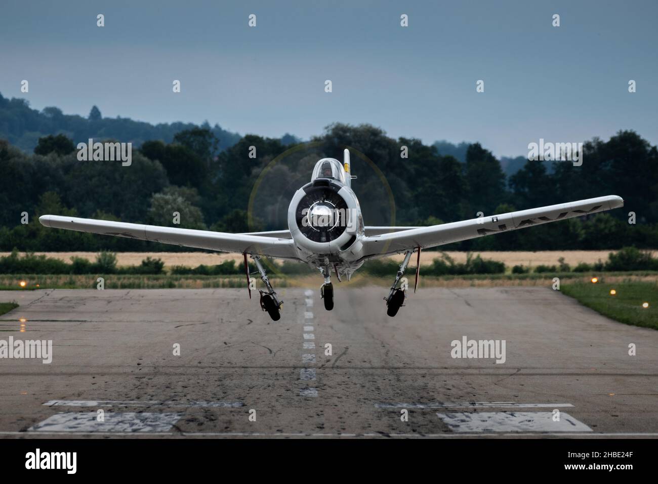 Oldtimer plane taking off wheel out Stock Photo - Alamy