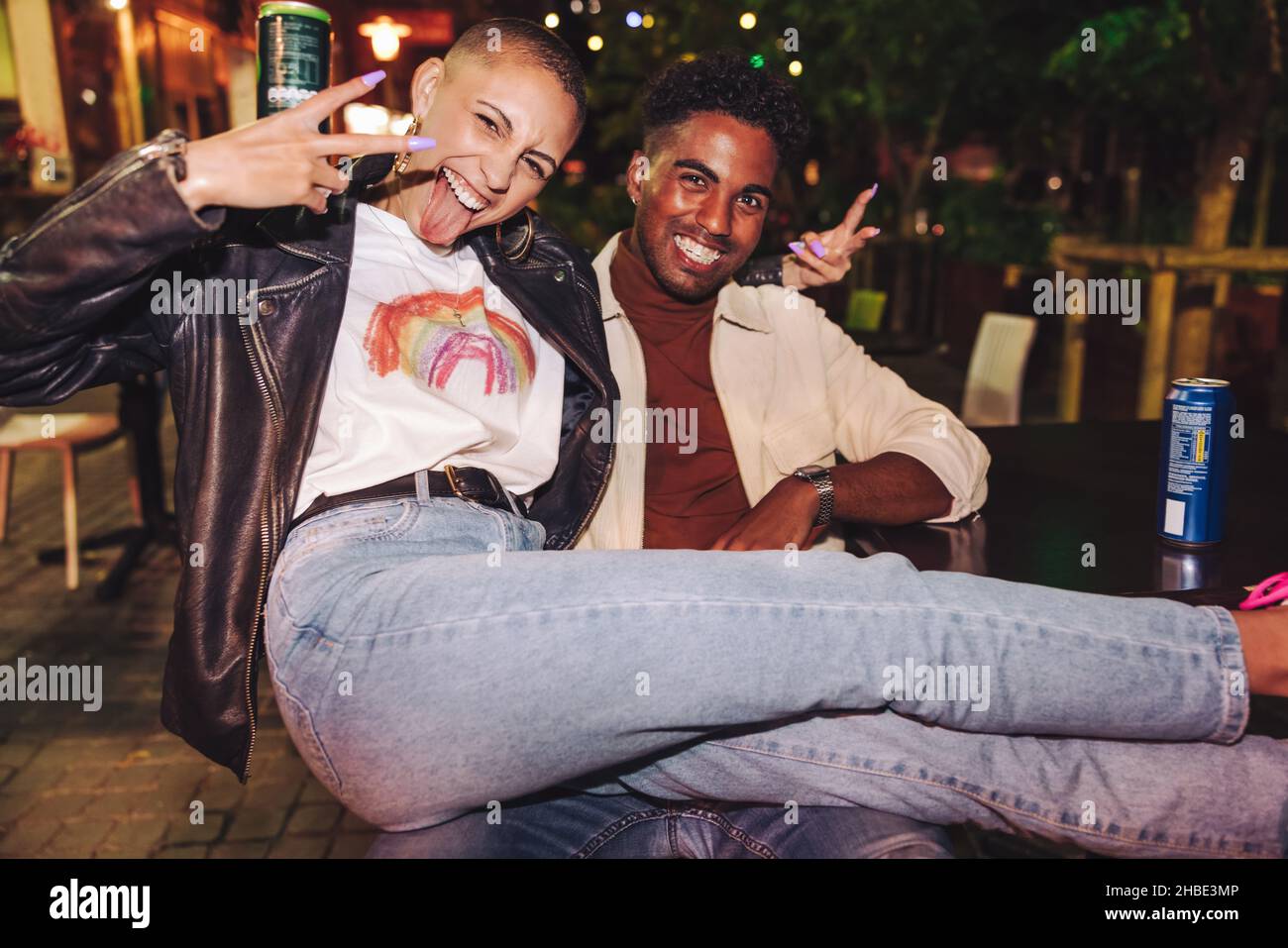 Peace out friends. Two best friends having a good time at an outdoor ...