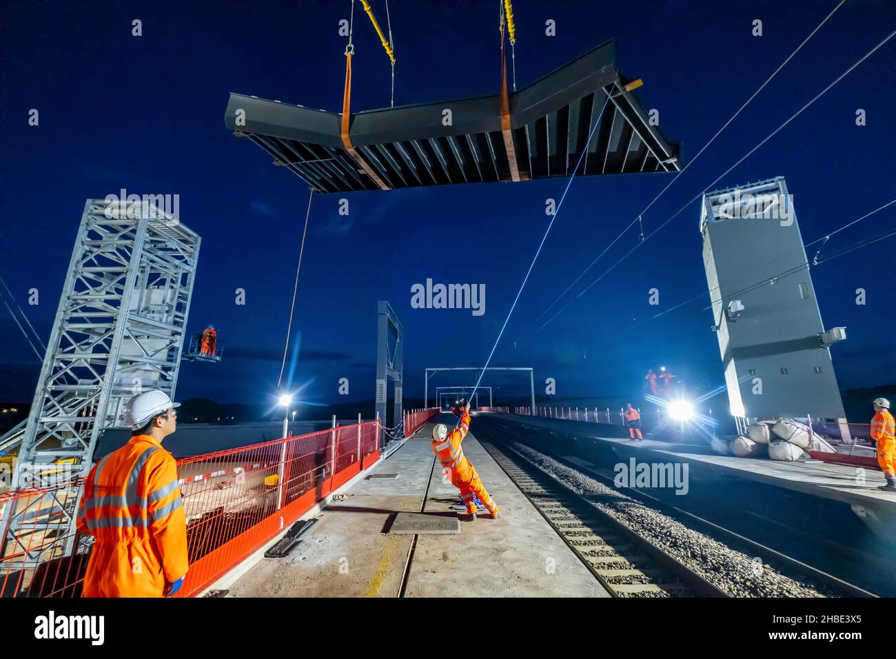 Railway workers building new railway and knocking down bridges Stock ...
