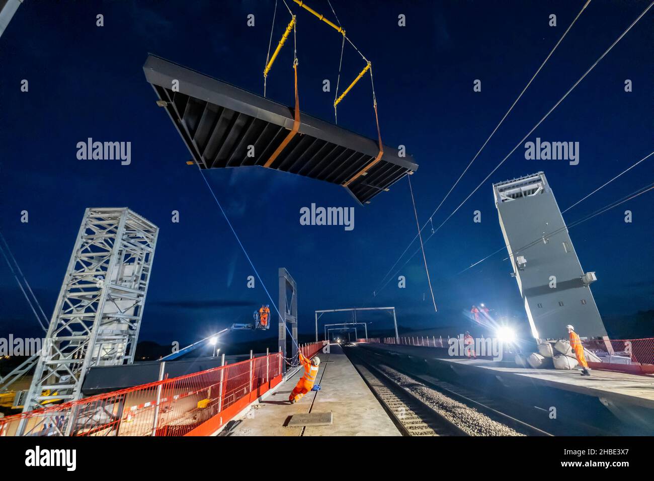 Railway workers building new railway and knocking down bridges Stock ...