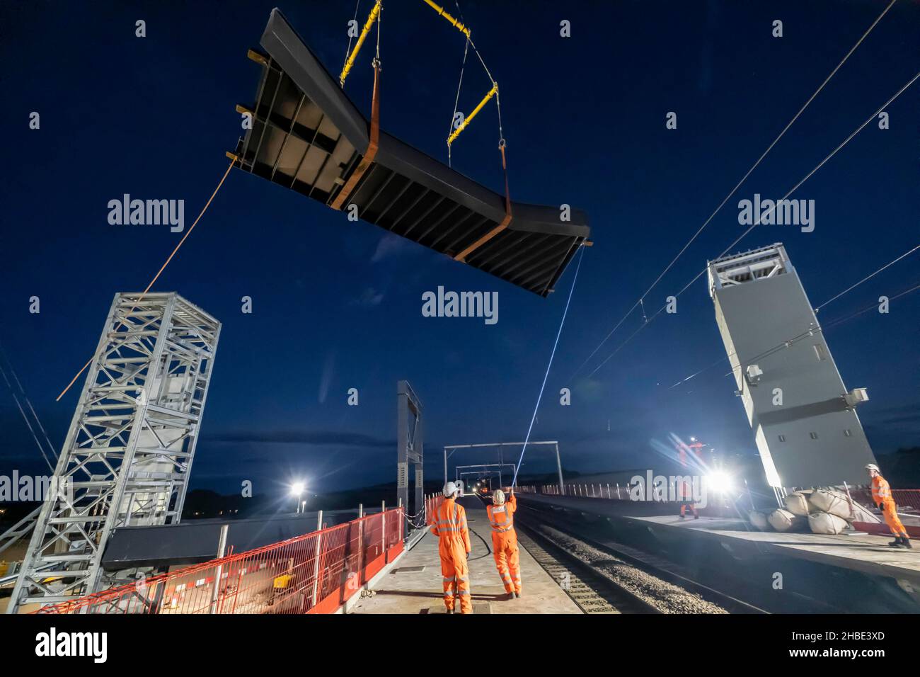 Railway workers building new railway and knocking down bridges Stock ...