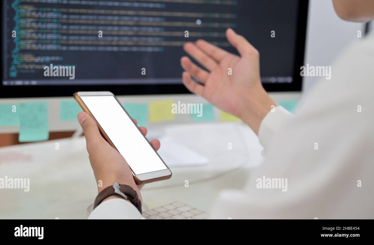 Close Up Shot Of Programmer Hand Using Blank Screen Smartphone Mockup