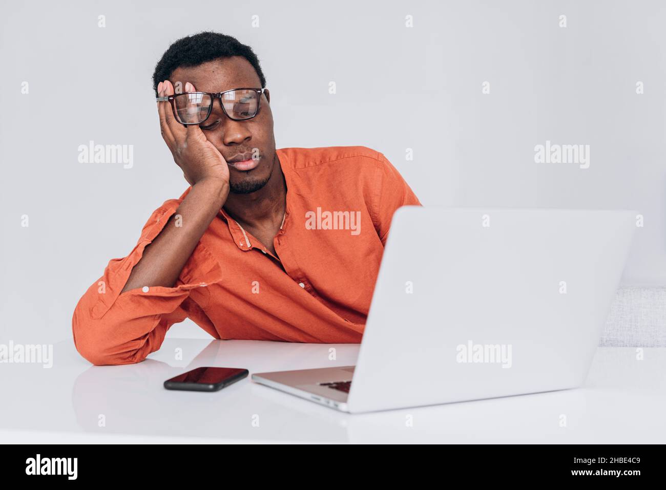 Black businessman sleeping desk hi-res stock photography and images - Alamy