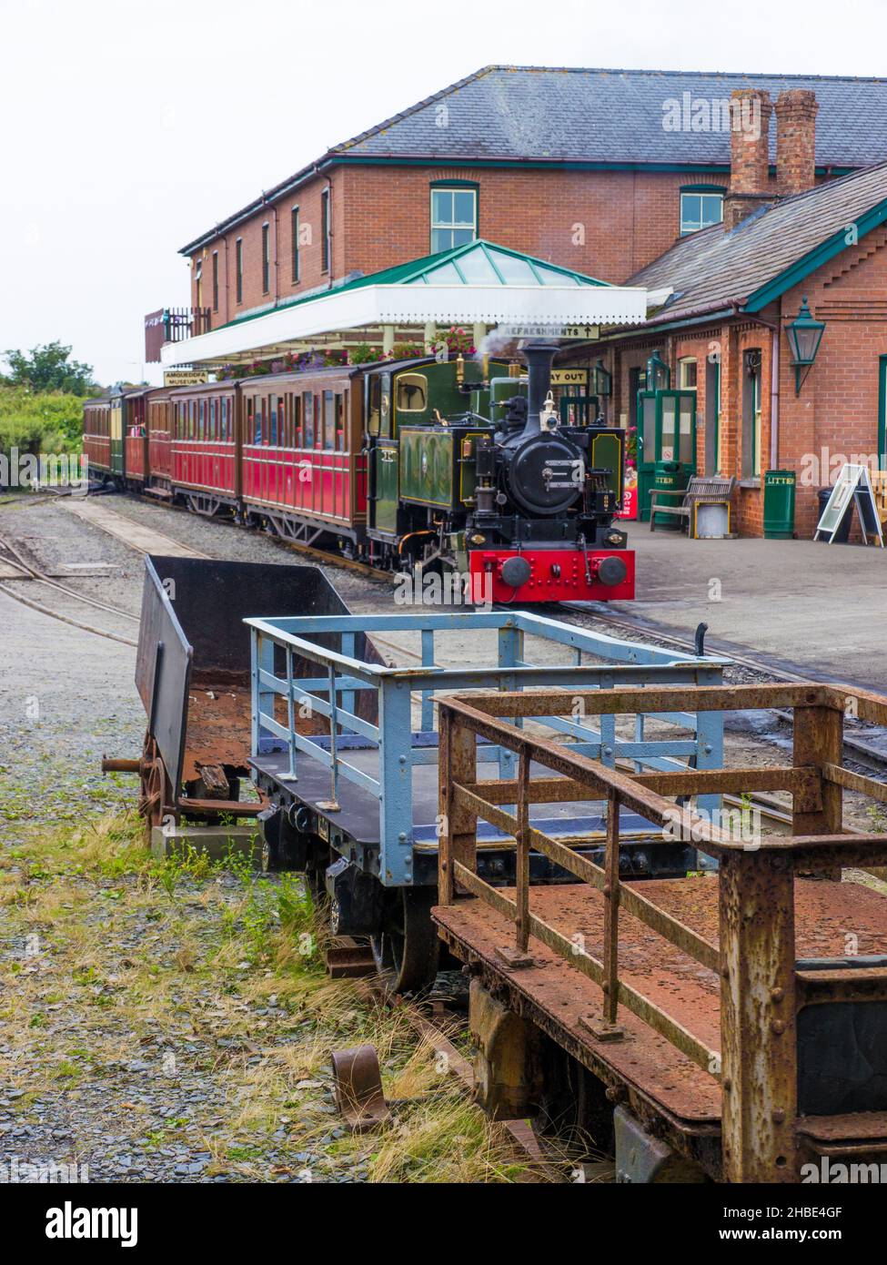 A train waits at Tywyn Wharf Station at the The Talyllyn Railway ...