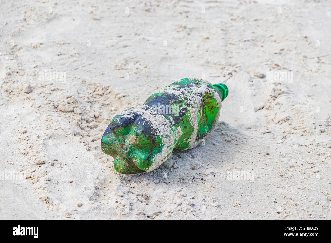 Plastic bottle stranded washed up garbage waste and trash pollution on ...