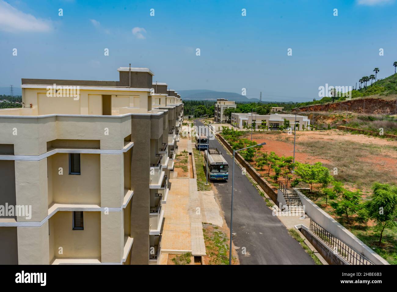 Top view of an Indian colony with bitumen road , building looking in ...