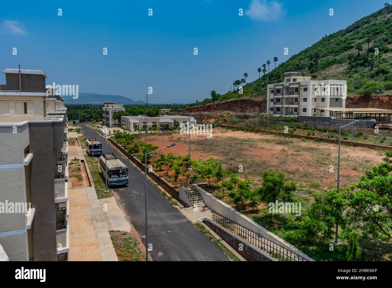 Top view of an Indian colony with bitumen road , building looking in ...