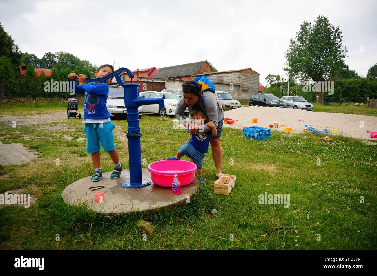 Boy pumping water hi-res stock photography and images - Alamy