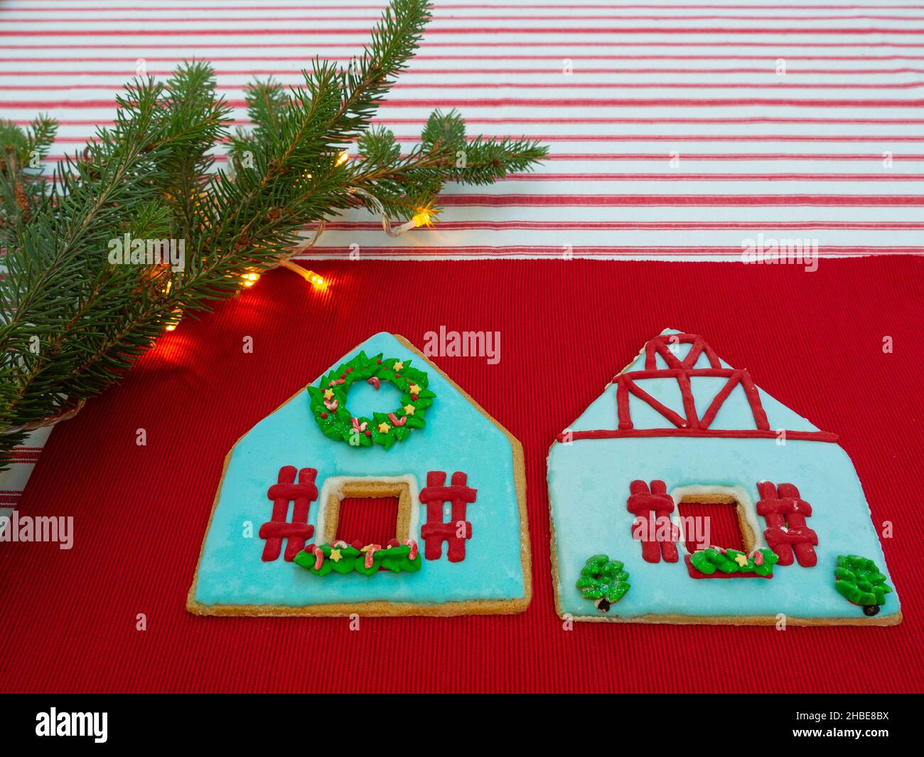 The parts of a gingerbread house for Christmas on a red and white ...