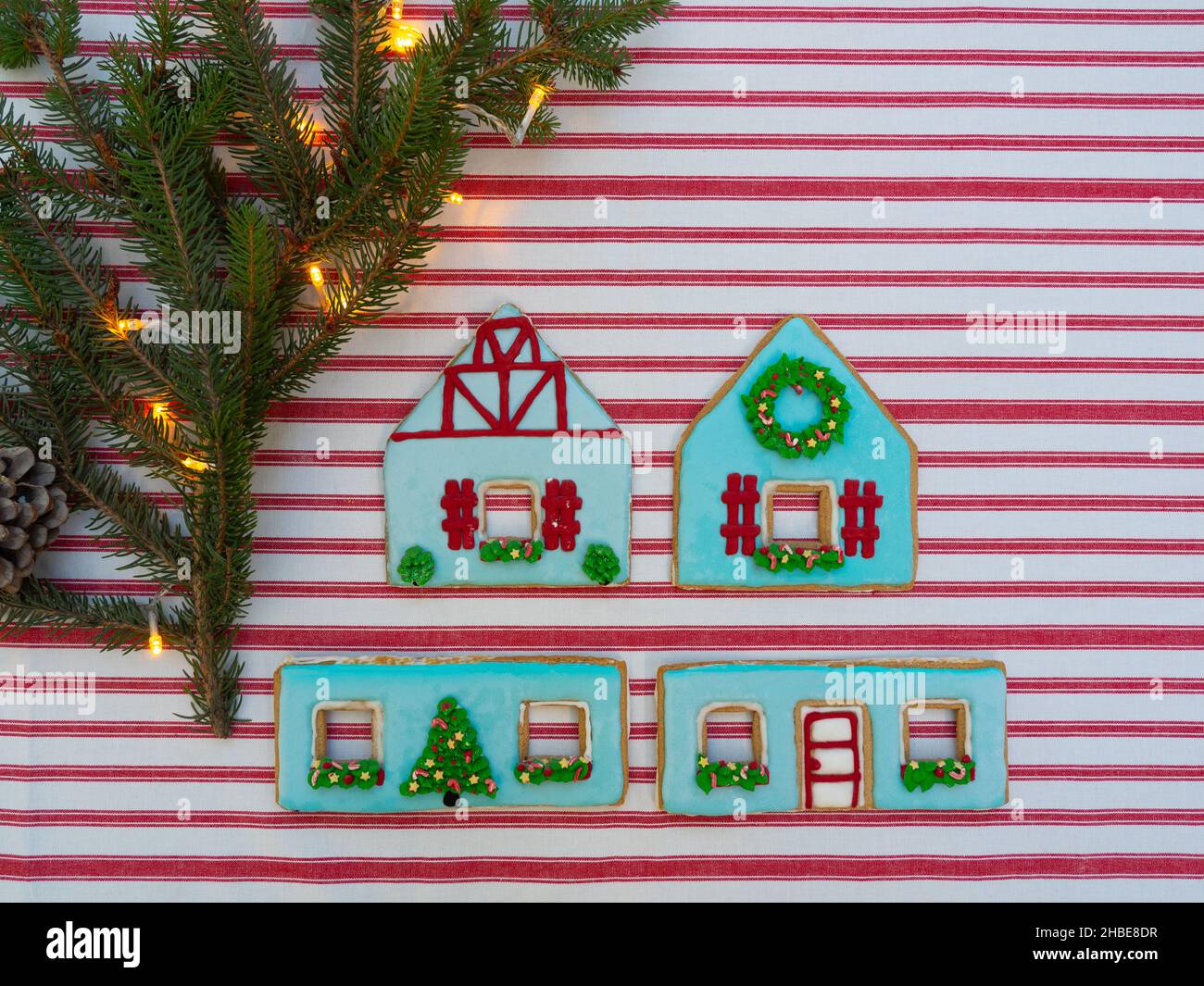 The parts of a gingerbread house for Christmas on a red and white ...