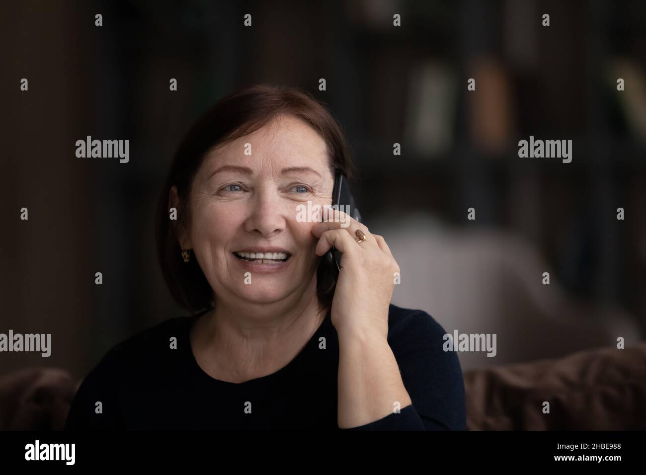 Pleasant old age woman make call enjoy talking on phone Stock Photo - Alamy