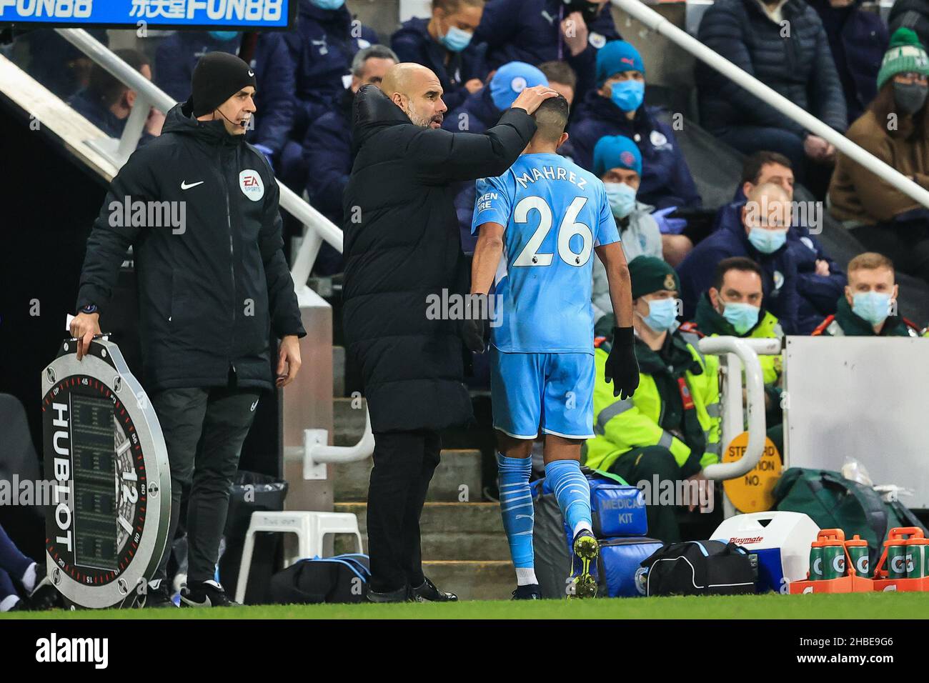 Josep Guardiola manager of Manchester City pats Riyad Mahrez #26 on the ...