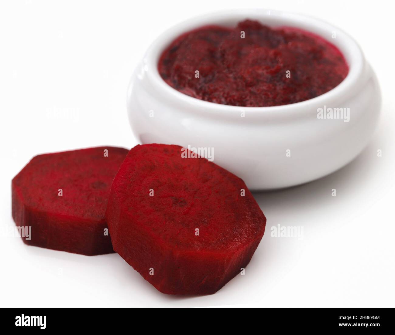 Beetroot paste in a bowl over white background Stock Photo - Alamy