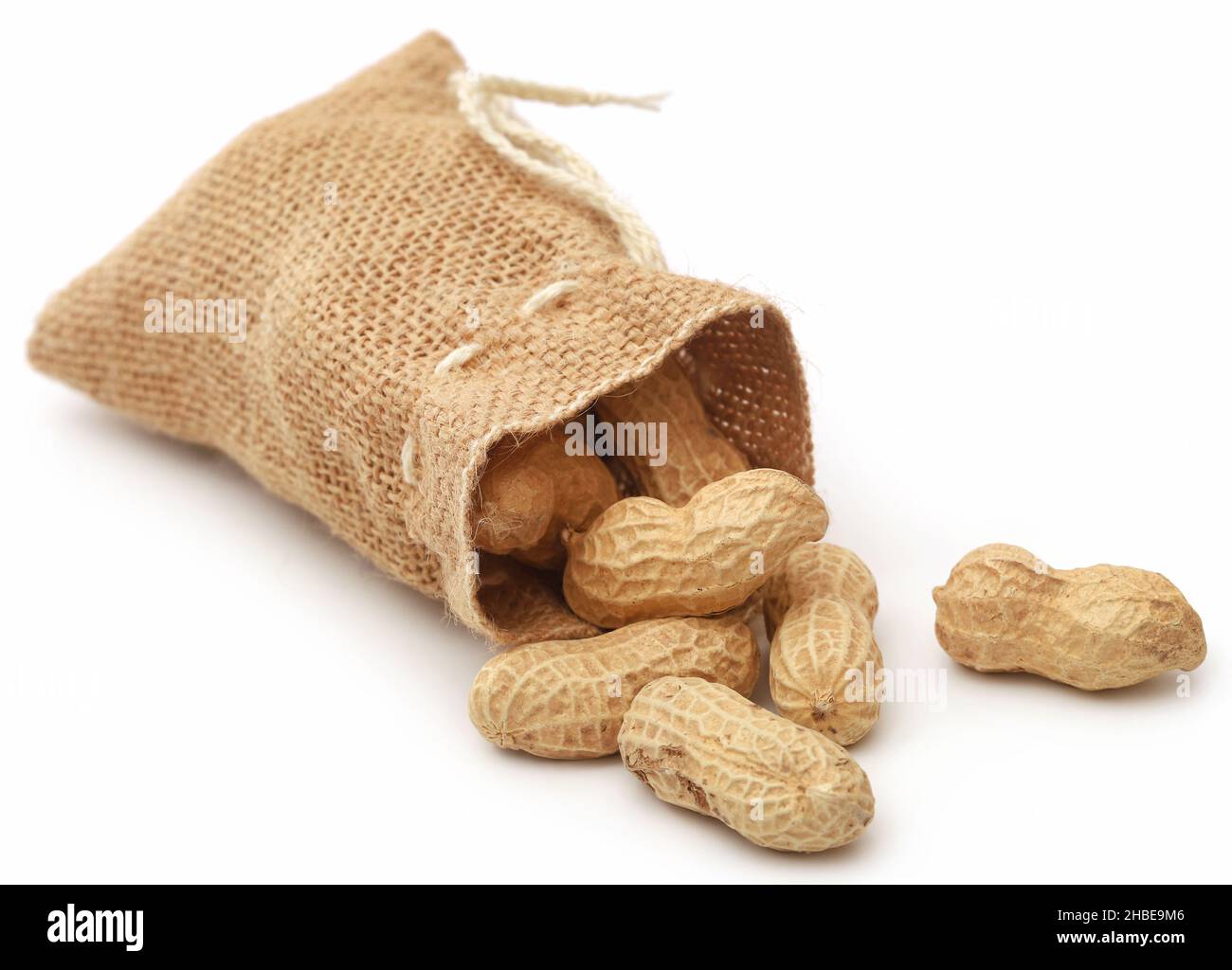 Fresh Peanuts in sack over white background Stock Photo - Alamy