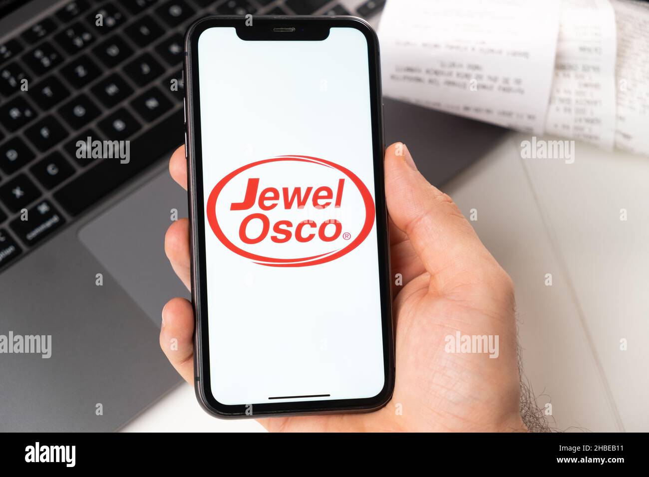 Jewel Osco application on the screen of Apple iPhone in mans hand and ...