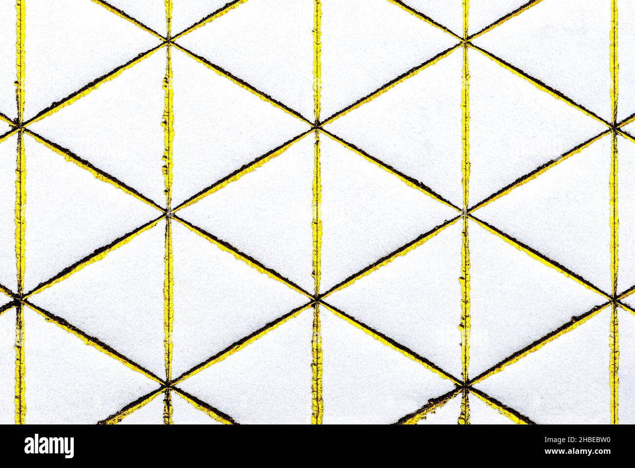 Gold diamond and triangle shaped lines engraved on white paper, top ...