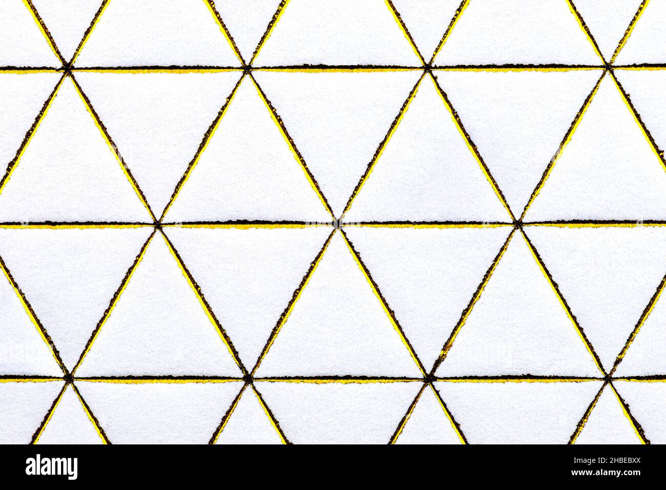Gold diamond and triangle shaped lines engraved on white paper, top ...