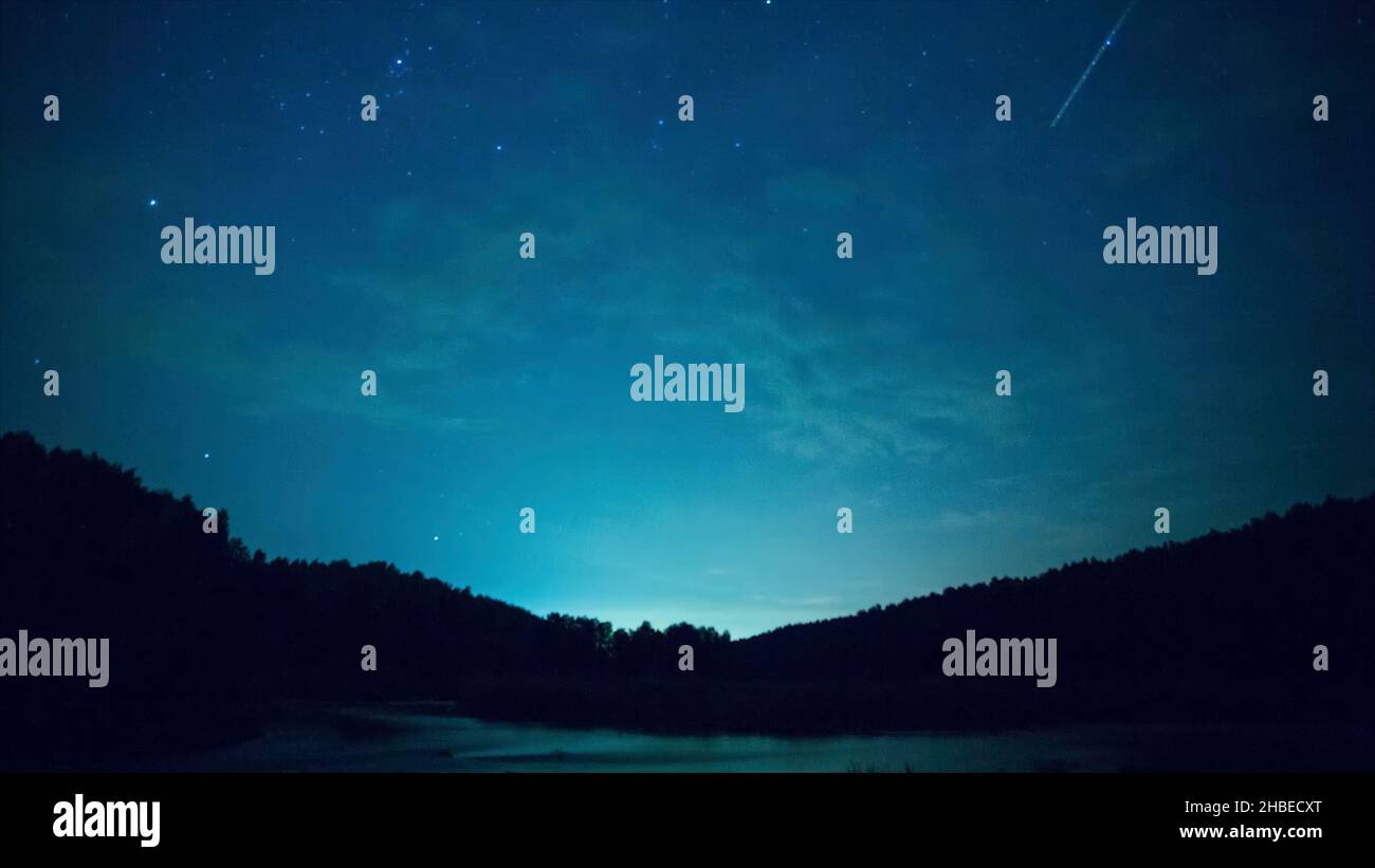 Stars over the lake at summer night on dark sky. Starfall. Amazing ...