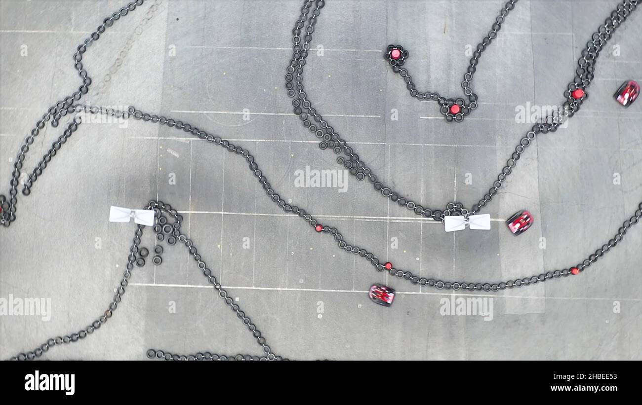 Aerial view of the karting track with moving small red karts, race and ...