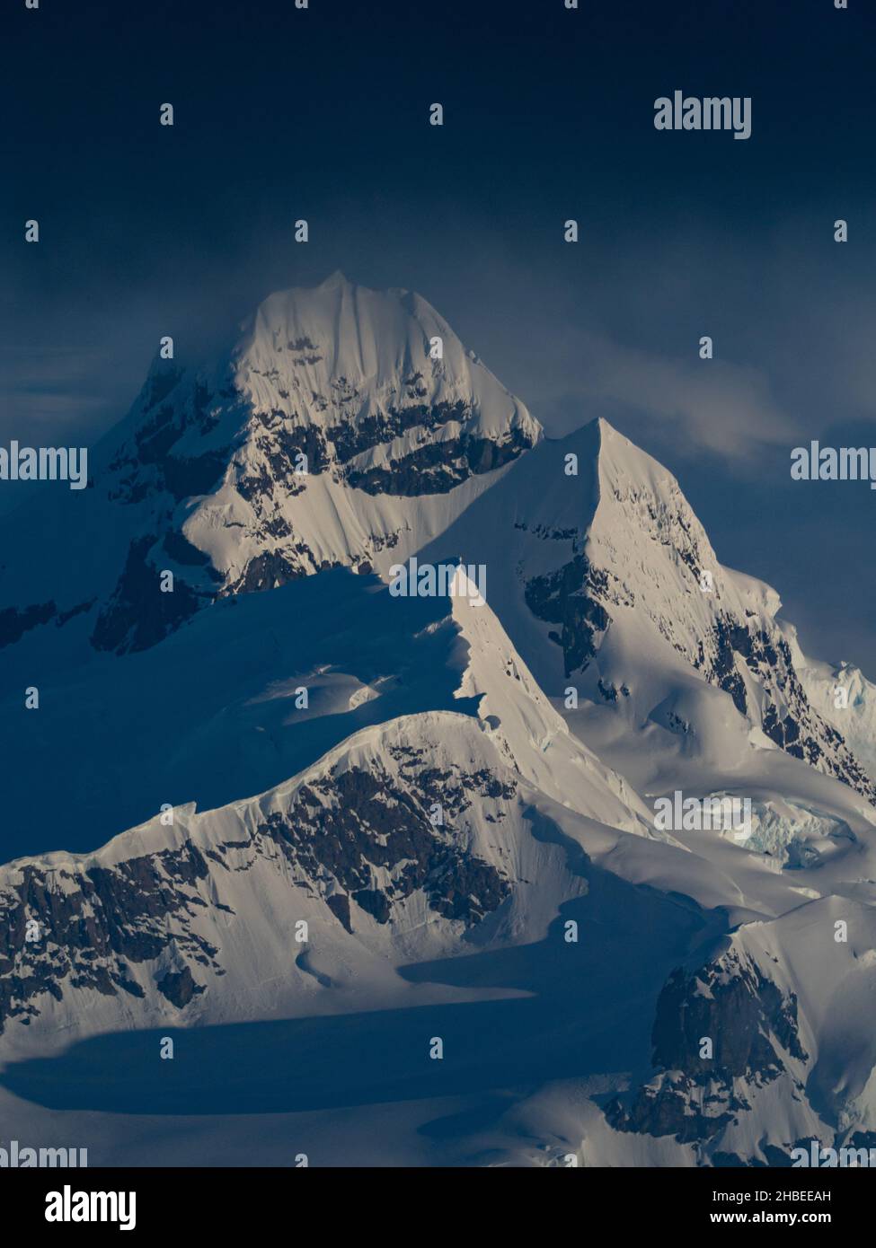 Stunning views of tall ice covered mountains along the Antarctic ...