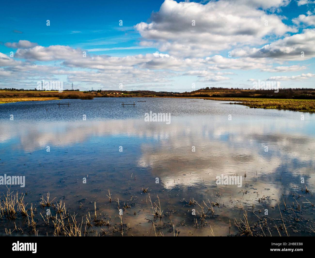 Clouds reflected in wetlands at Fairburn Ings, West Yorkshire, England ...