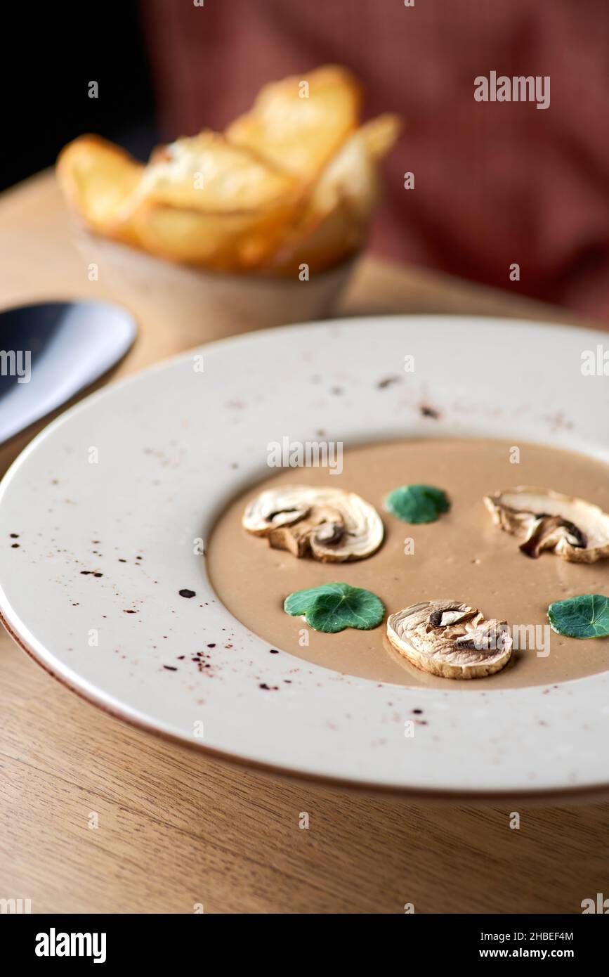 Vegetarian food. Mushroom soup puree with cream, porcini, champignons ...
