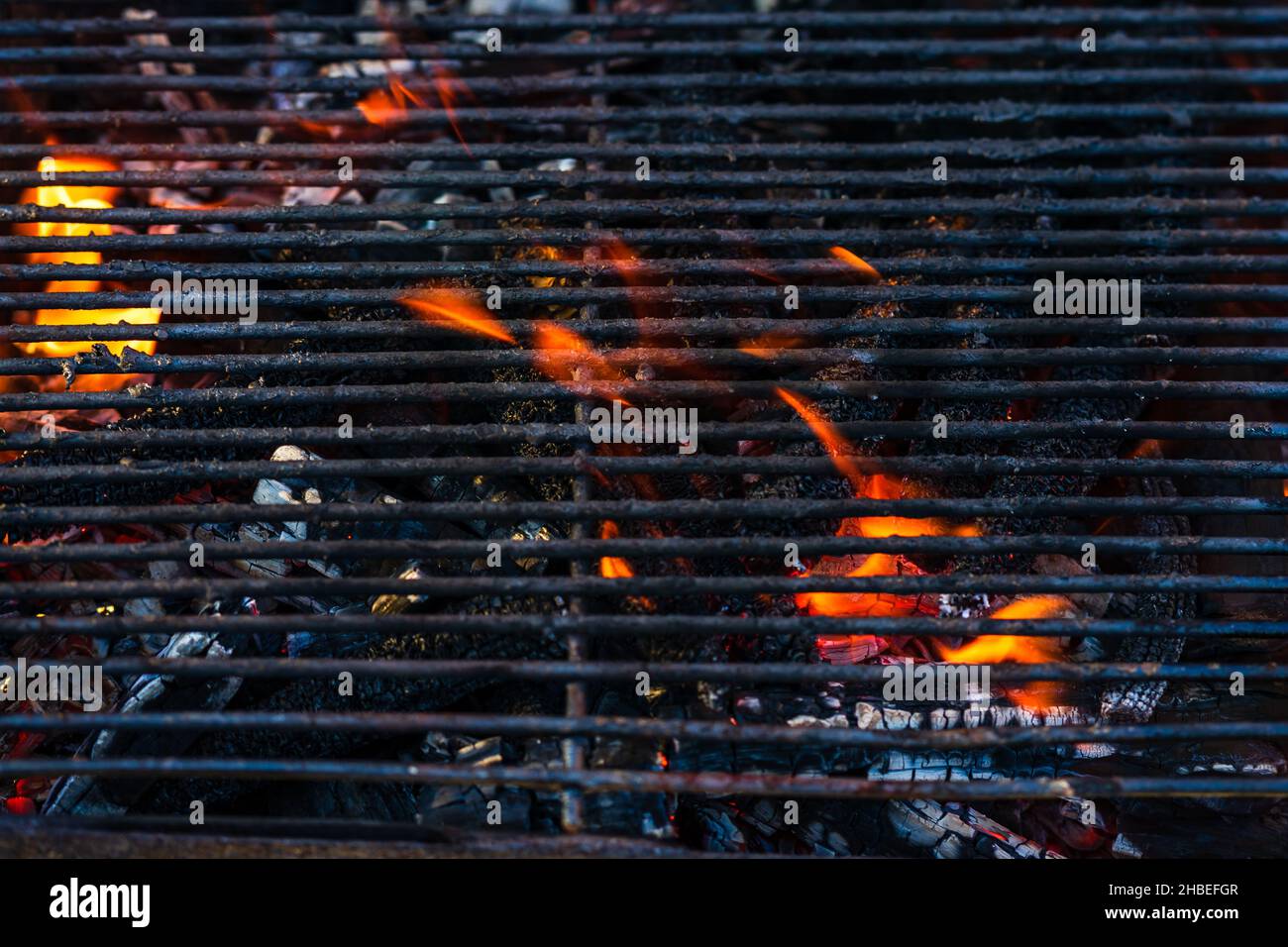 An empty hot charcoal barbecue grill with bright flame Stock Photo - Alamy