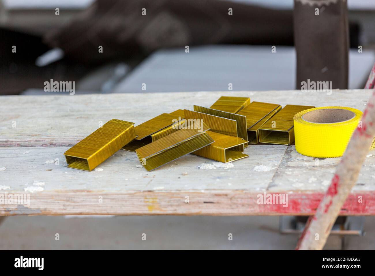 Pile of large construction staples heaped together on a scaffolding ...