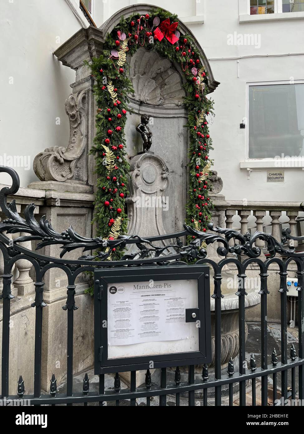 The Manneken Pis statue stands at the corner of Rue de l'Etuve and Rue ...