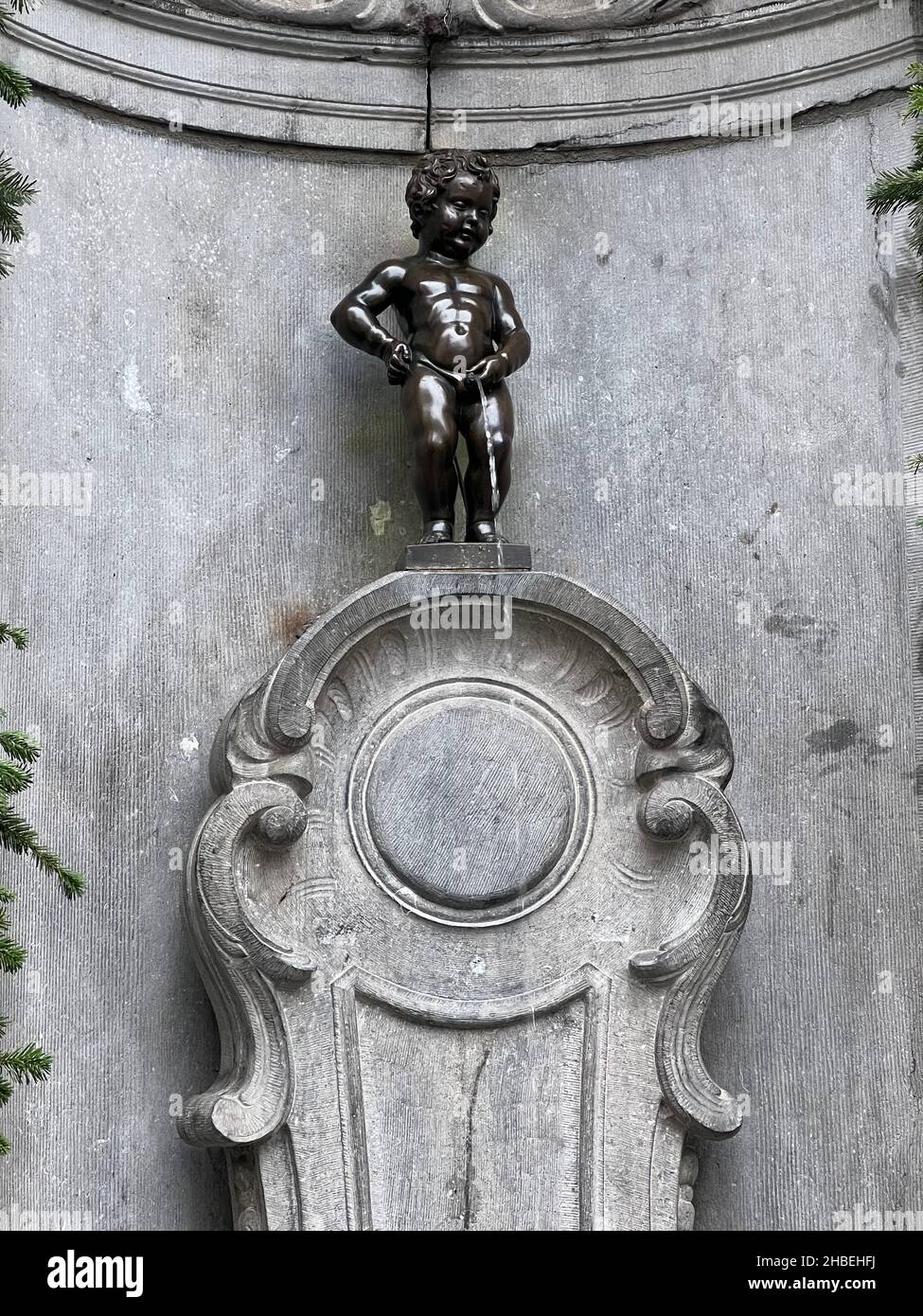 The Manneken Pis statue stands at the corner of Rue de l'Etuve and Rue ...