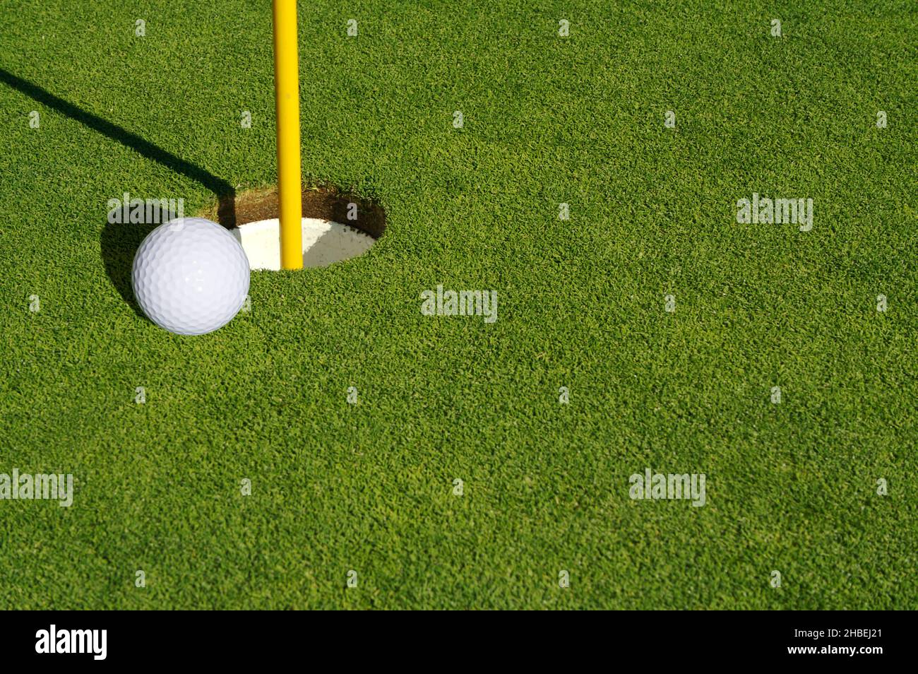 Close-up of Golf Course Green, Flag Pin and Ball Stock Photo - Alamy