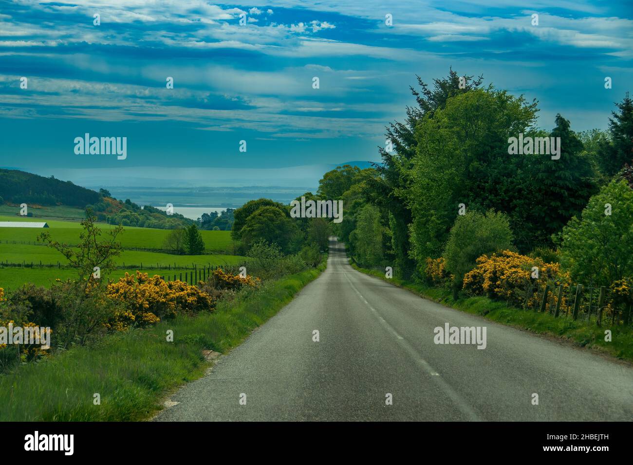 Straight road through rural landscape, Beauly, Highlands, Scotland, UK ...