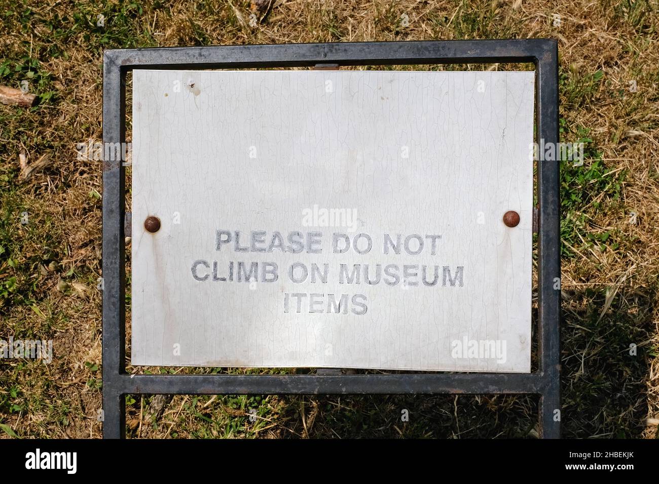 Please do not climb on museum items sign board Stock Photo - Alamy